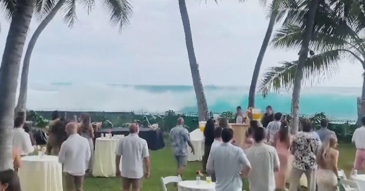 Huge Hawaii waves crash into homes — and weddings — in 'historic' swell
