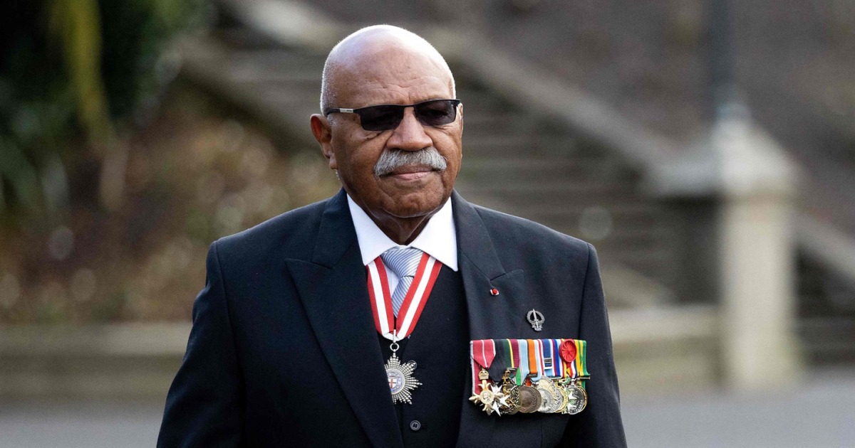 Fijian leader trips while looking at cellphone, cancels trip to China