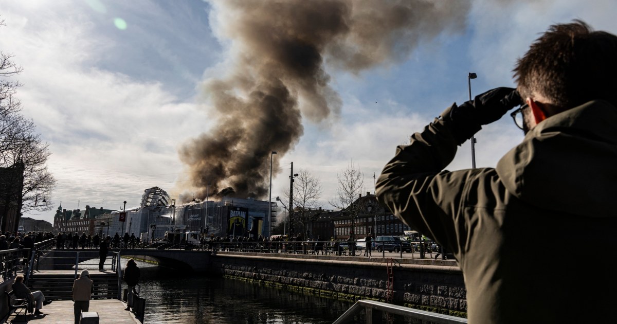 Copenhagen fire rages; stock exchange spire collapses