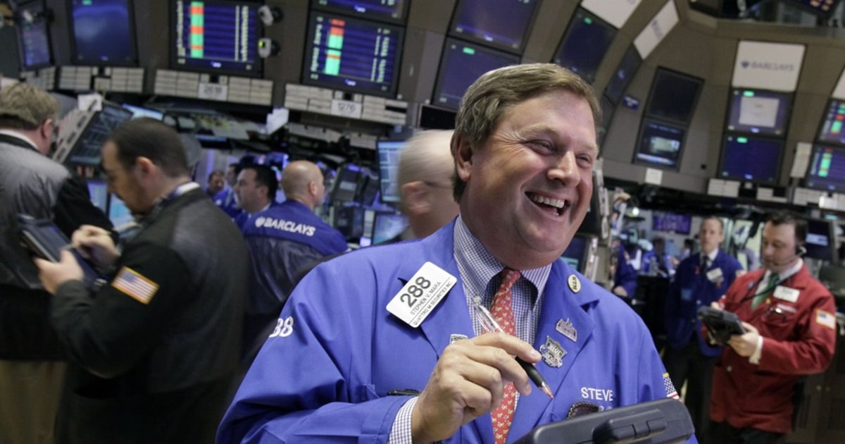 Stocks rally, supported by earnings; Dow tops 13,000