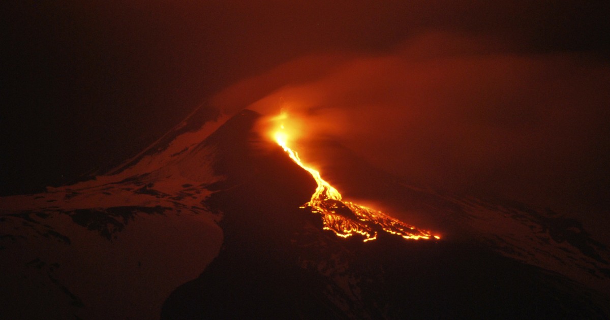 Italy's Mount Etna volcano glows during evening eruptions