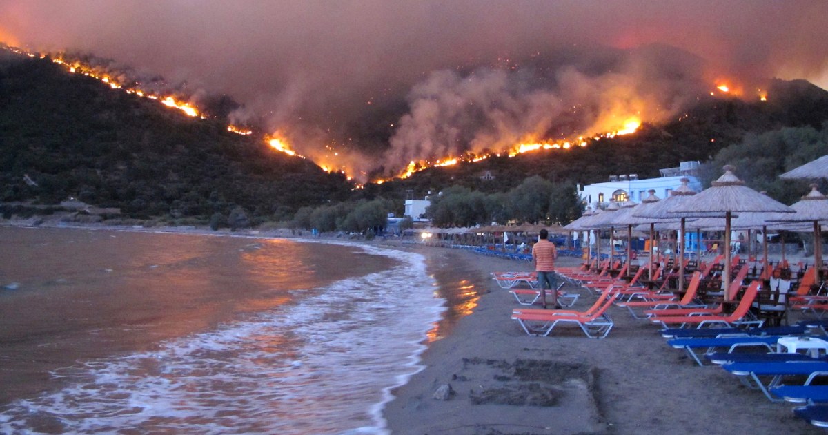 Burning at the beach: Greeks watch wildfire approach