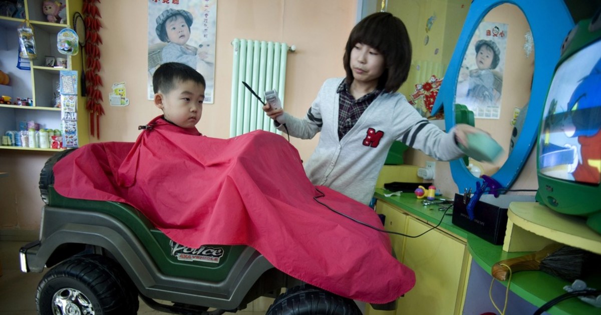 A dragon raises its head and the barber picks up the clippers