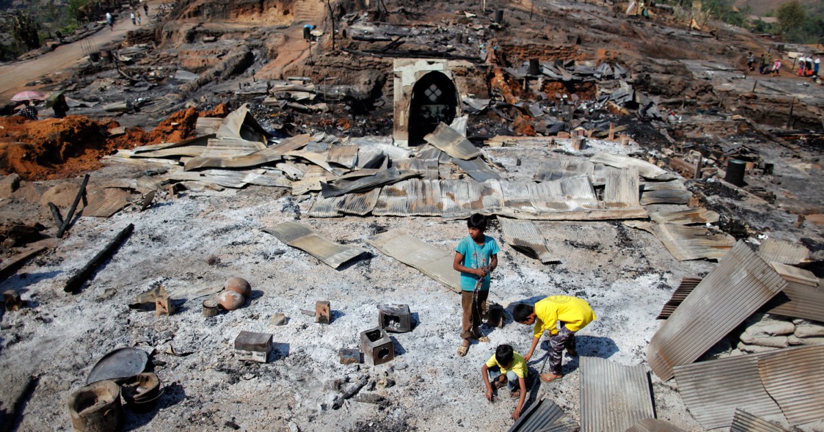 Among the charred ruins of a refugee camp, a smile remains