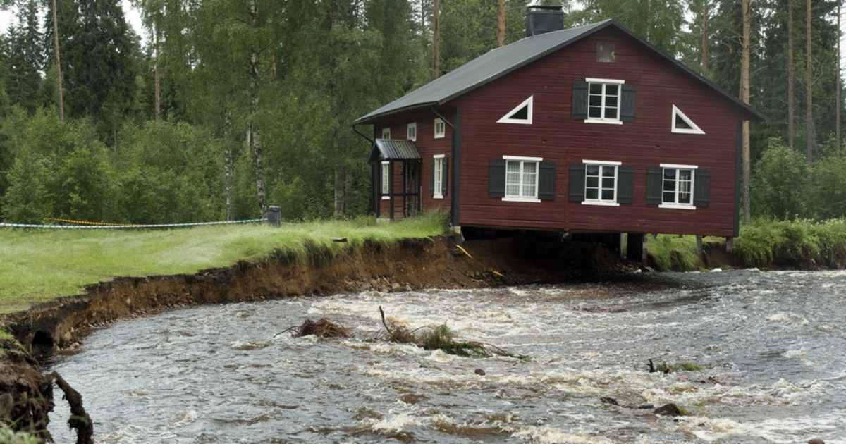 Flooding river in Sweden undercuts house foundation