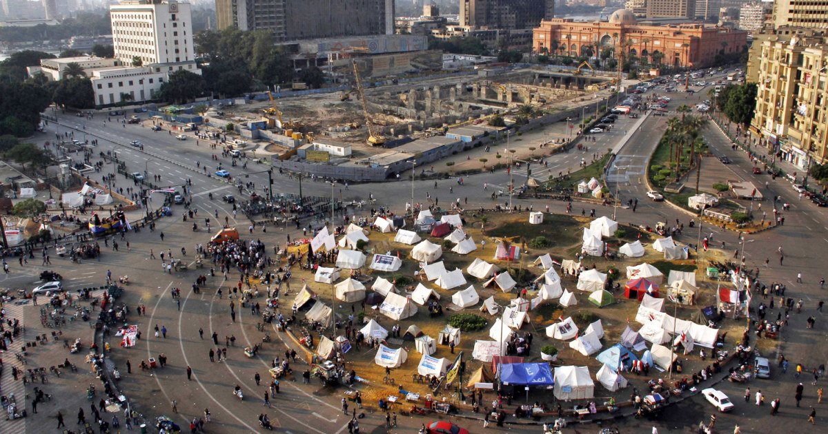 Protesters in Tahrir Square hold funeral for activist killed in clashes