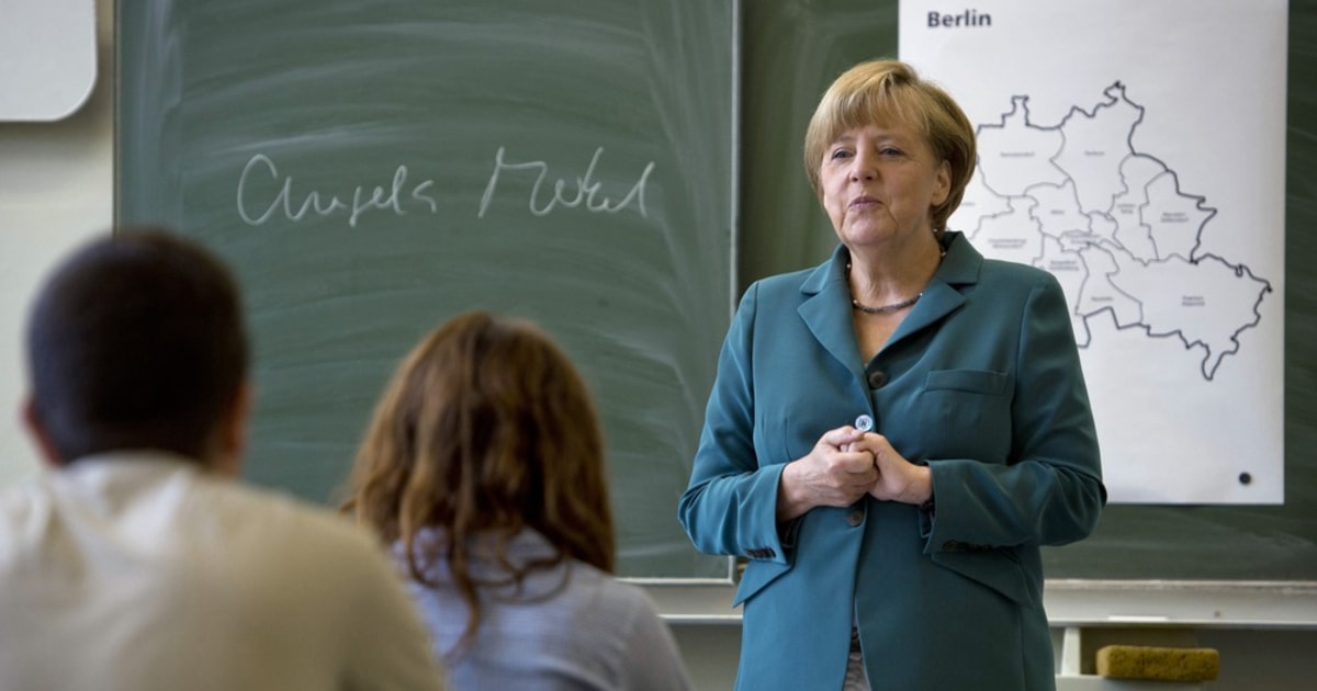 Germany's Angela Merkel teaches history class on Berlin Wall anniversary