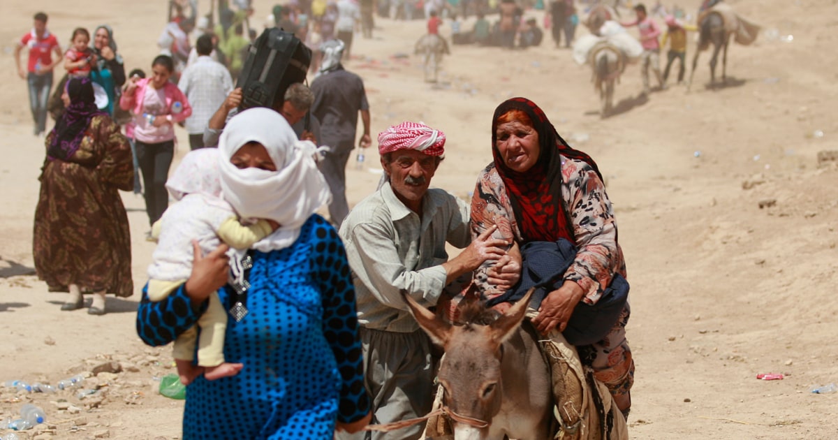 Exodus: Thousands of Syrian refugees escape into northern Iraq