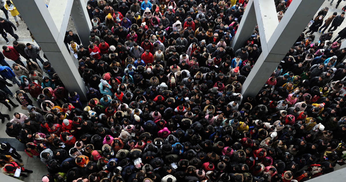 Taking a full load: Potential students crowd in for entrance exams in China