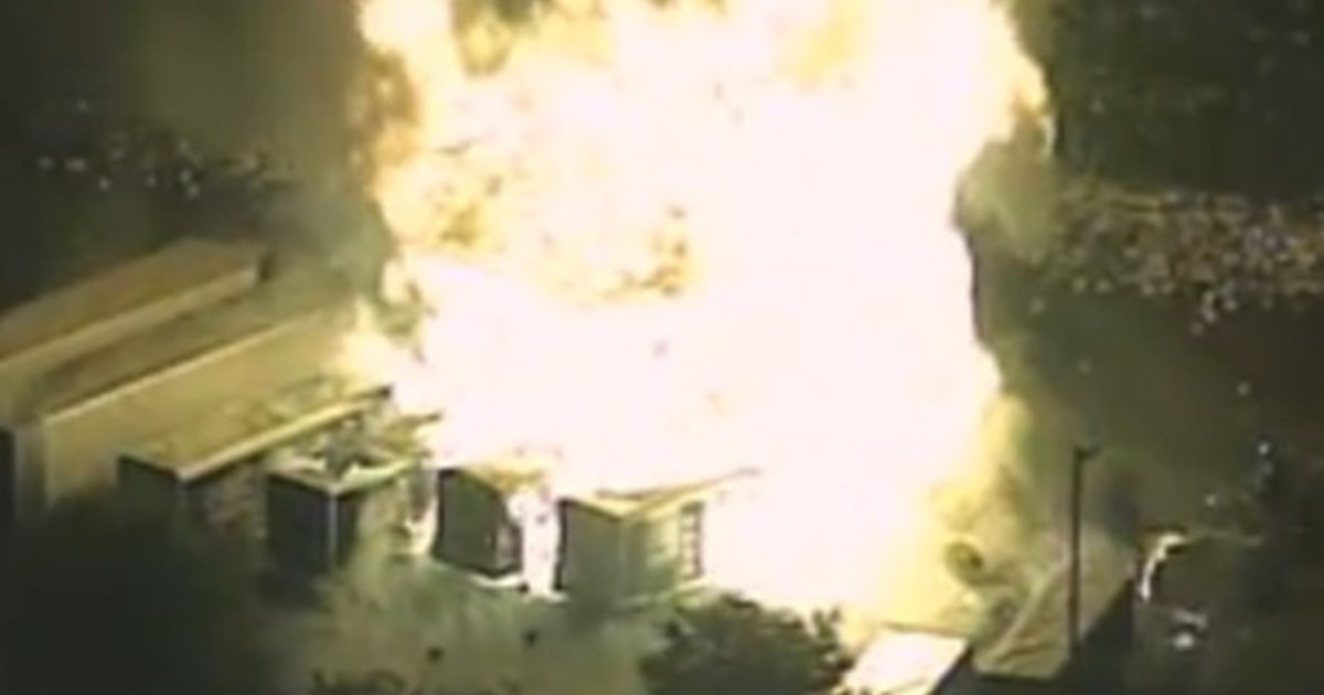 Thousands of destroyed propane tanks litter parking lot after plant ...