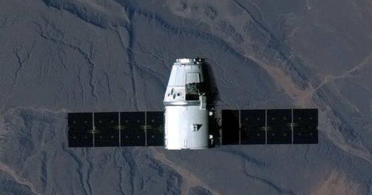 Space station crew brings SpaceX's Dragon cargo craft in for a hookup