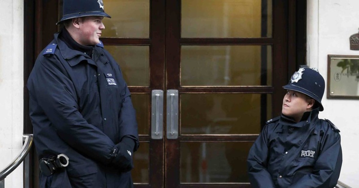 Little and large cop duo stand guard outside Queen's hospital