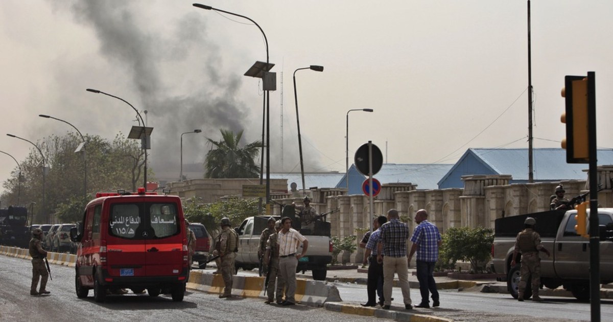 Blasts, raid on government building kill at least 24 in Baghdad