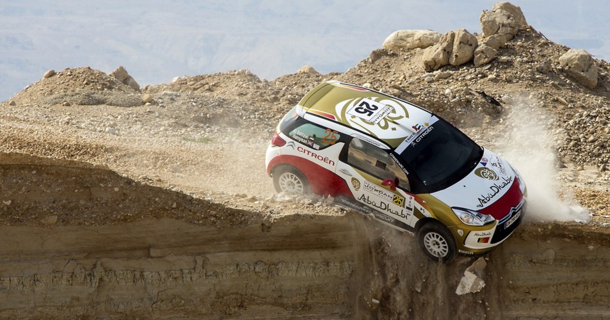World Rally Championship driver drives off 20-foot cliff, lands upside ...