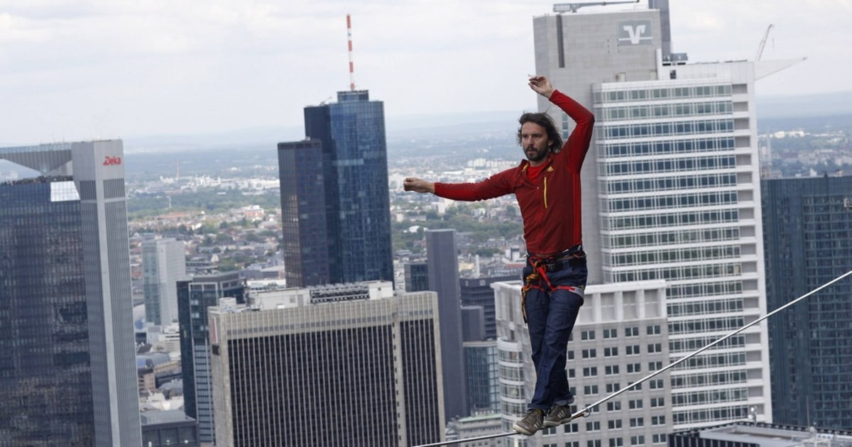 Man walks on high rope despite fear of heights