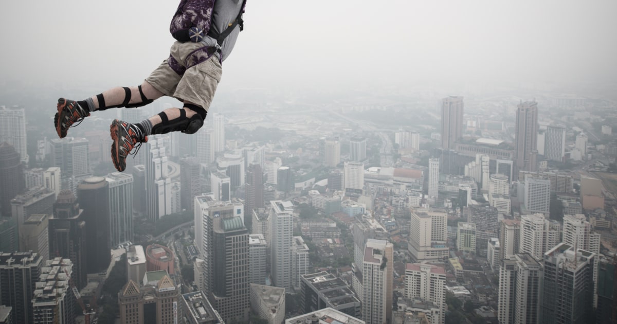 Falling or flying? BASE jumpers leap off Kuala Lumpur tower