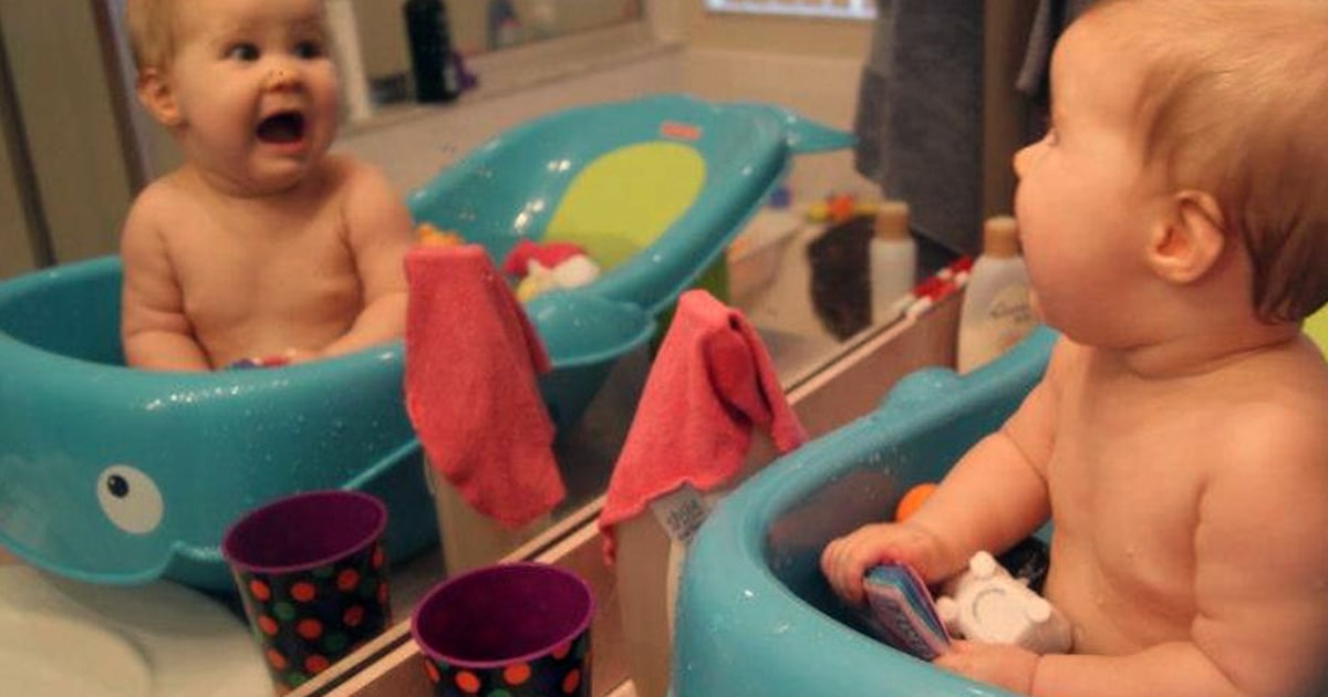 Yikes! Baby is startled by her own reflection