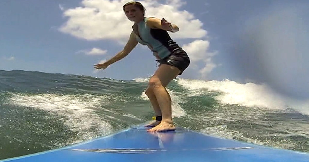 Hang 10! Natalie gets a lesson in surfing