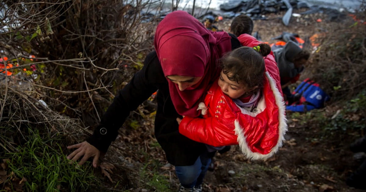 Groups of volunteers donate baby slings to Syrian migrants