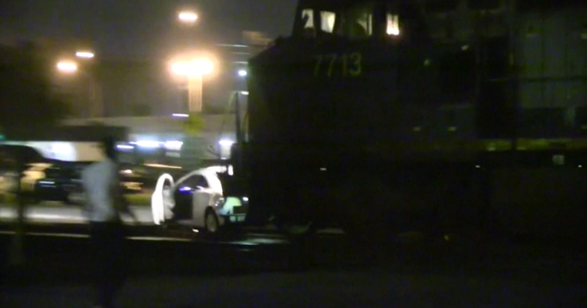 Caught on video: Train smashes into car stuck on tracks in Orlando