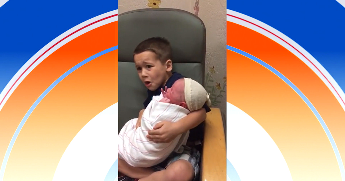 See boy’s hilarious reaction to holding baby brother for the first time