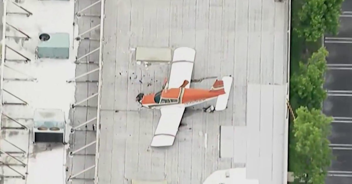 Small plane crash-lands on office building roof; 1 person injured
