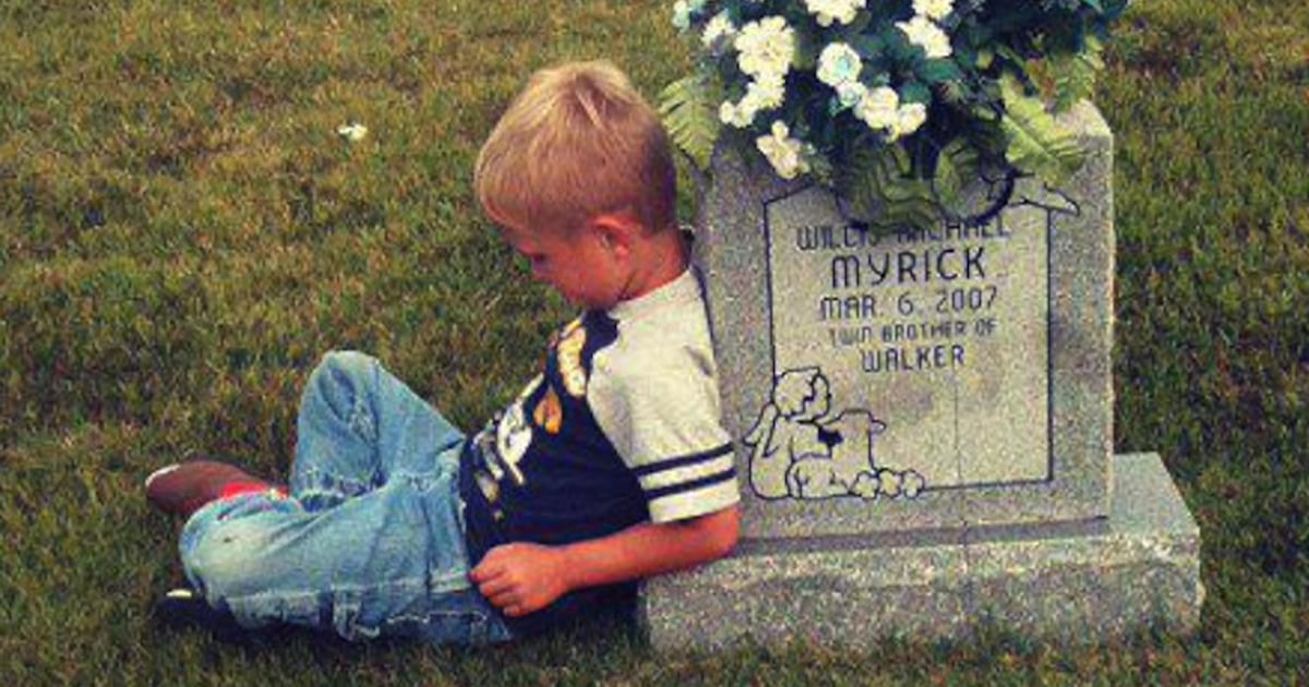 Little boy visits grave to honor identical twin who died in the womb