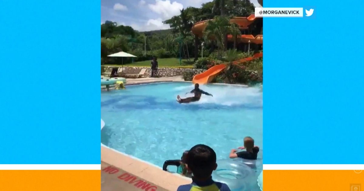 Watch lifeguard emerge from waterpark slide, glide across water
