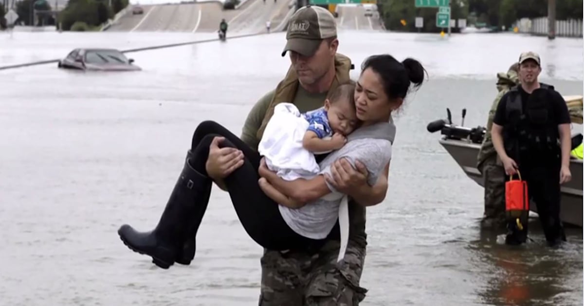 Here’s the story behind one powerful rescue photo from Hurricane Harvey