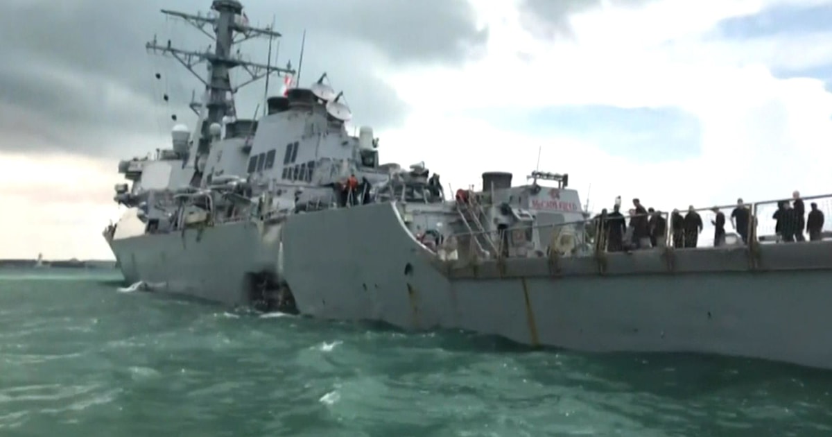 Navy destroyer collides with merchant ship; at least 10 missing