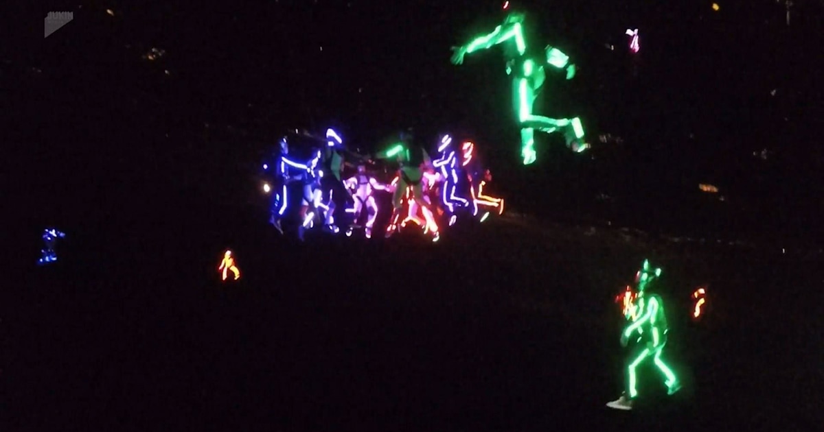 Watch these skydivers light up the night sky