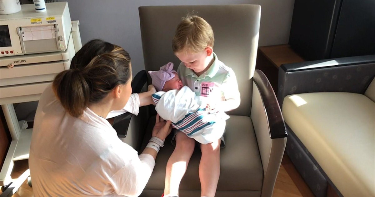Older brother welcomes new baby sister in the most adorable way
