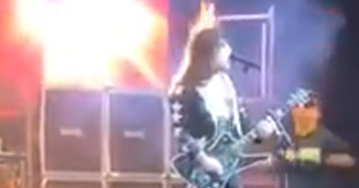 Guitarist’s hair catches fire on stage, but he keeps playing