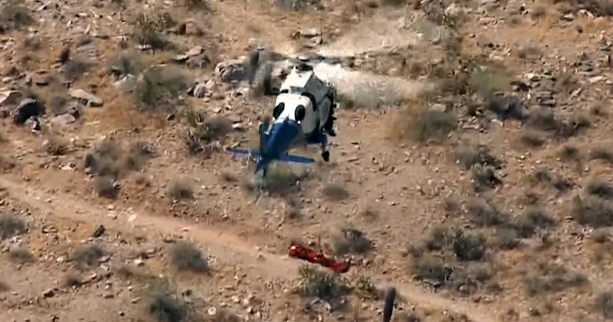 Helicopter stretcher carrying injured hiker spins out of control