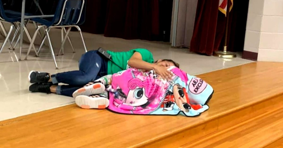 School janitor comforts elementary student with autism
