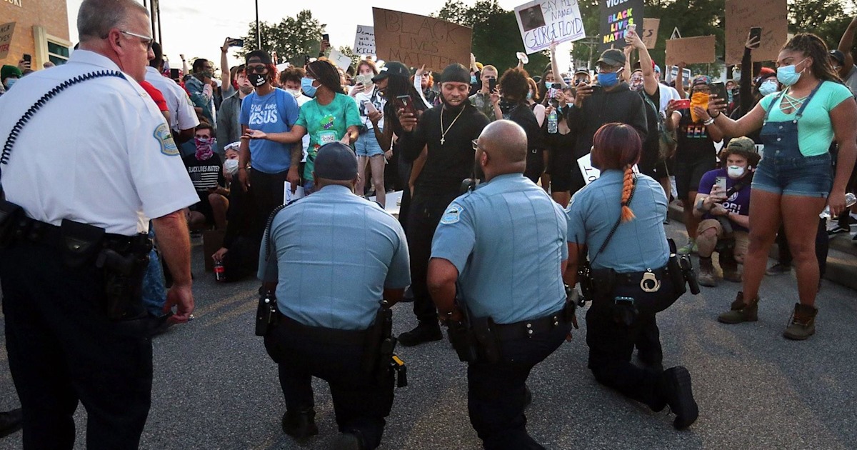 Some police join peaceful protests in moments of solidarity