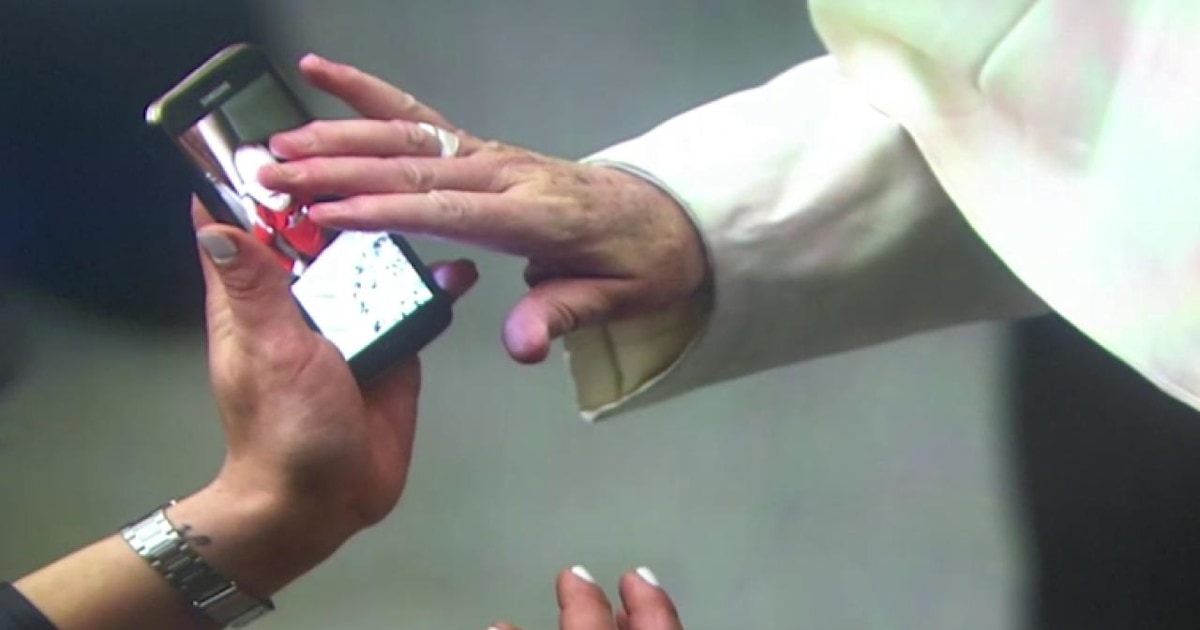 Pope Francis embraces technology, blesses smartphone photo