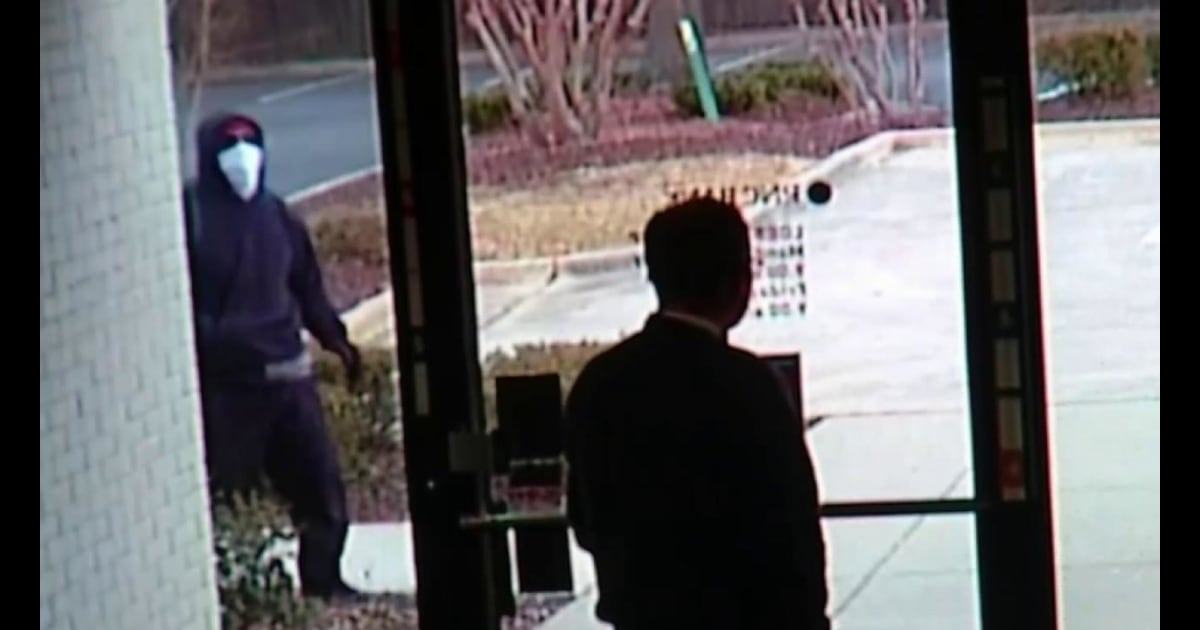 Video: Bank manager keeps would-be robber out by holding the door closed