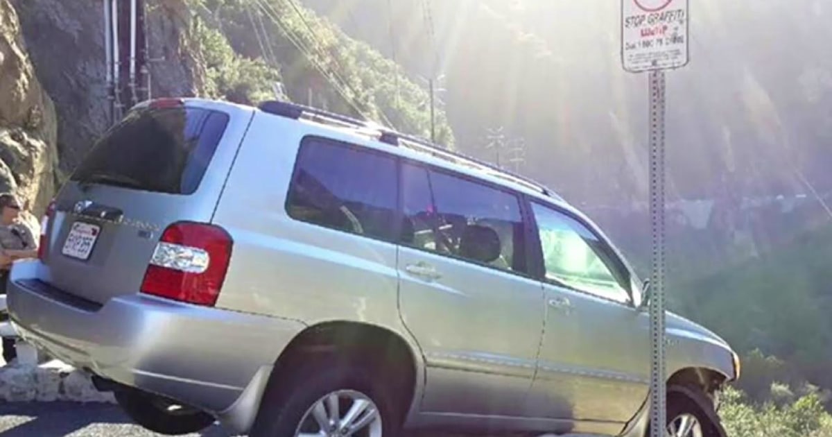 Driver exits vehicle dangling over cliff, is hit by bus