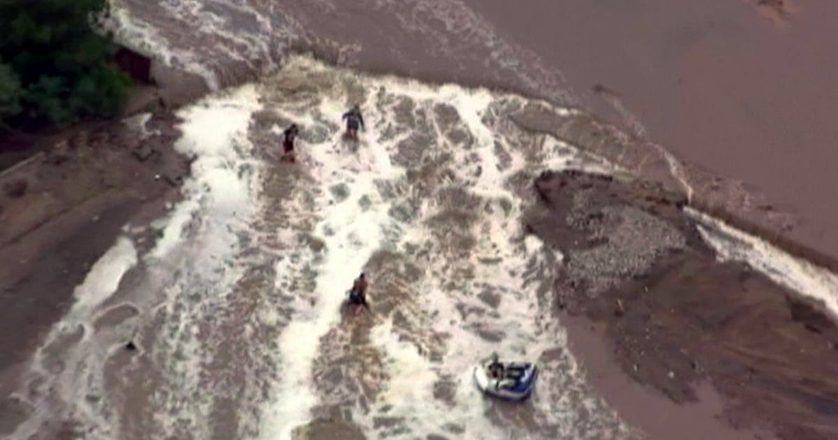 Don’t try this at home! Rafters surf through flash flood