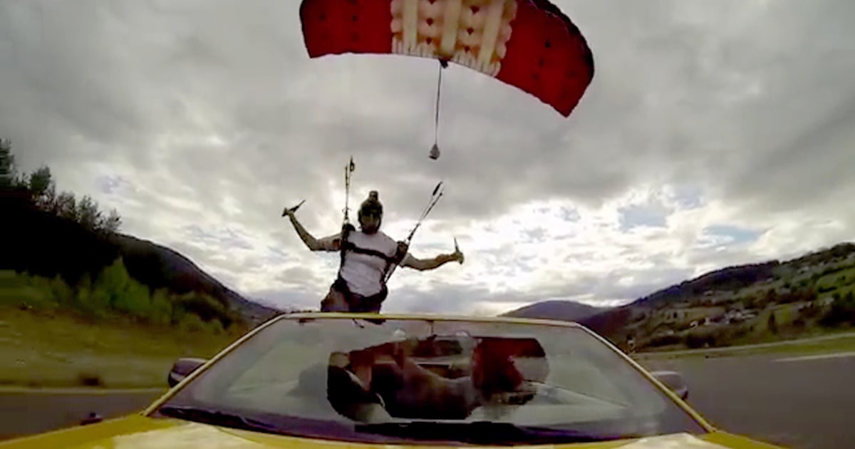 Female daredevil jumps from plane into moving car