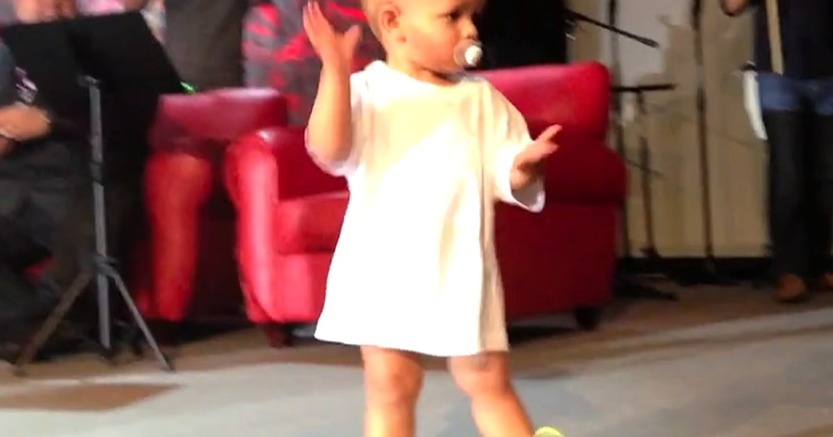 Dancing baby steals spotlight from singer