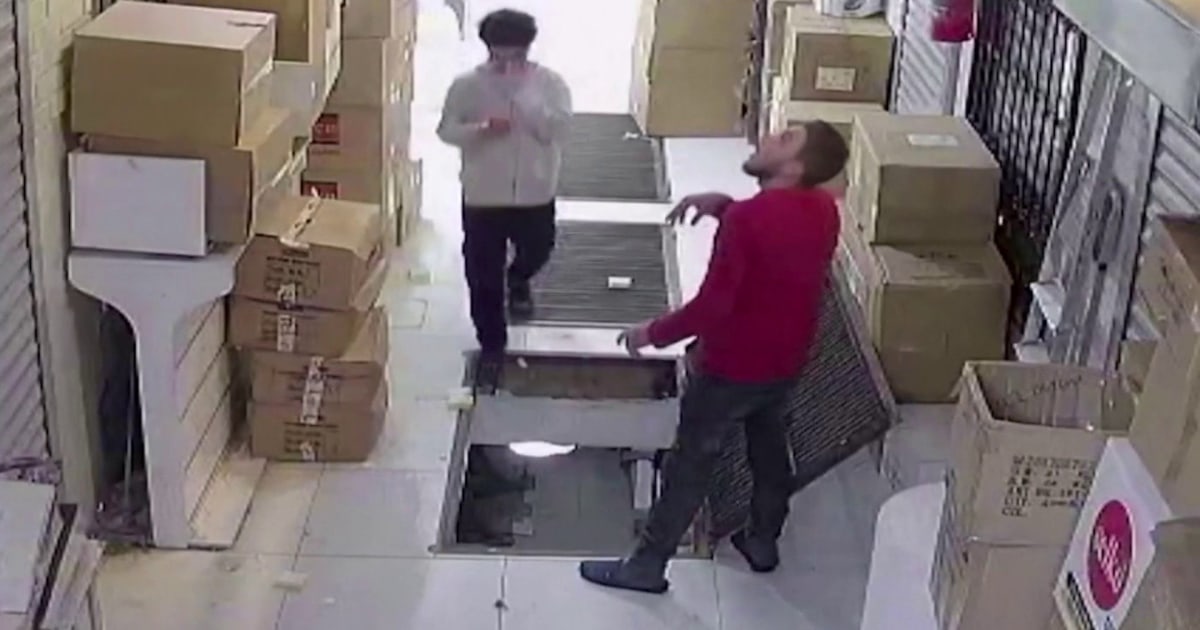 Watch: Man falls through hole while distracted by phone (with a lucky ...