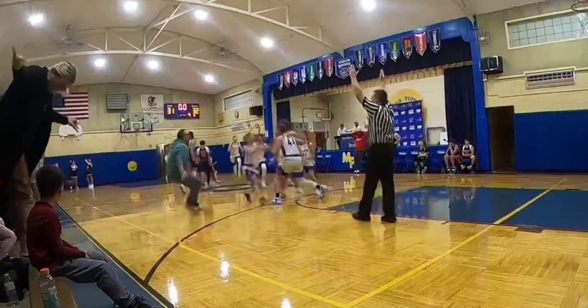 Middle school basketball player sinks a full-court buzzer shot