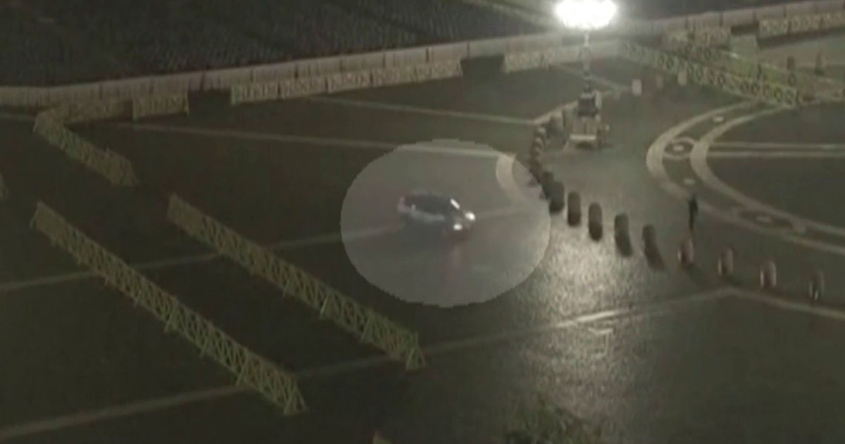 Car speeds through Vatican City gate onto palace courtyard