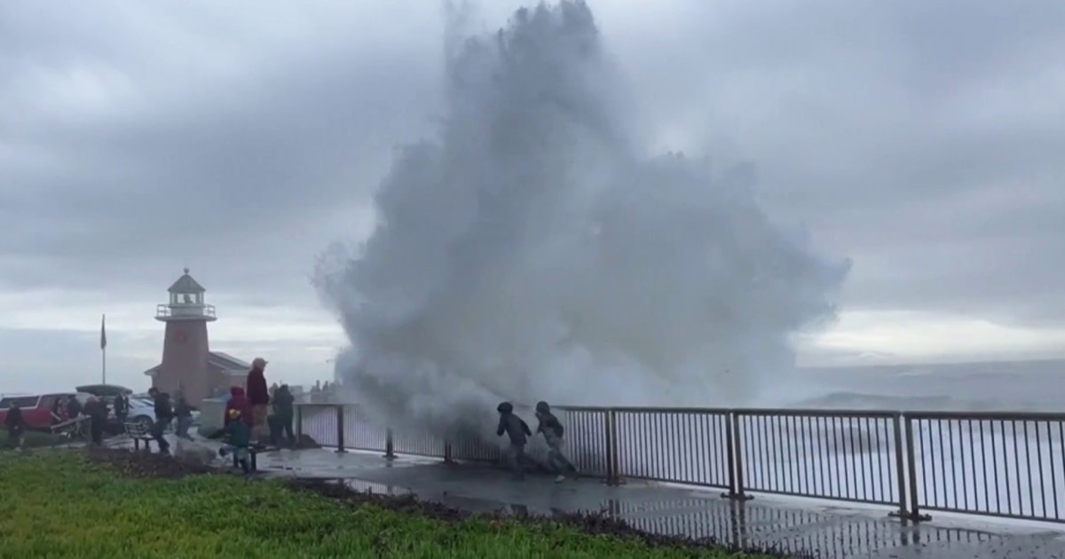 Rogue waves slam California beach, knocking down onlookers