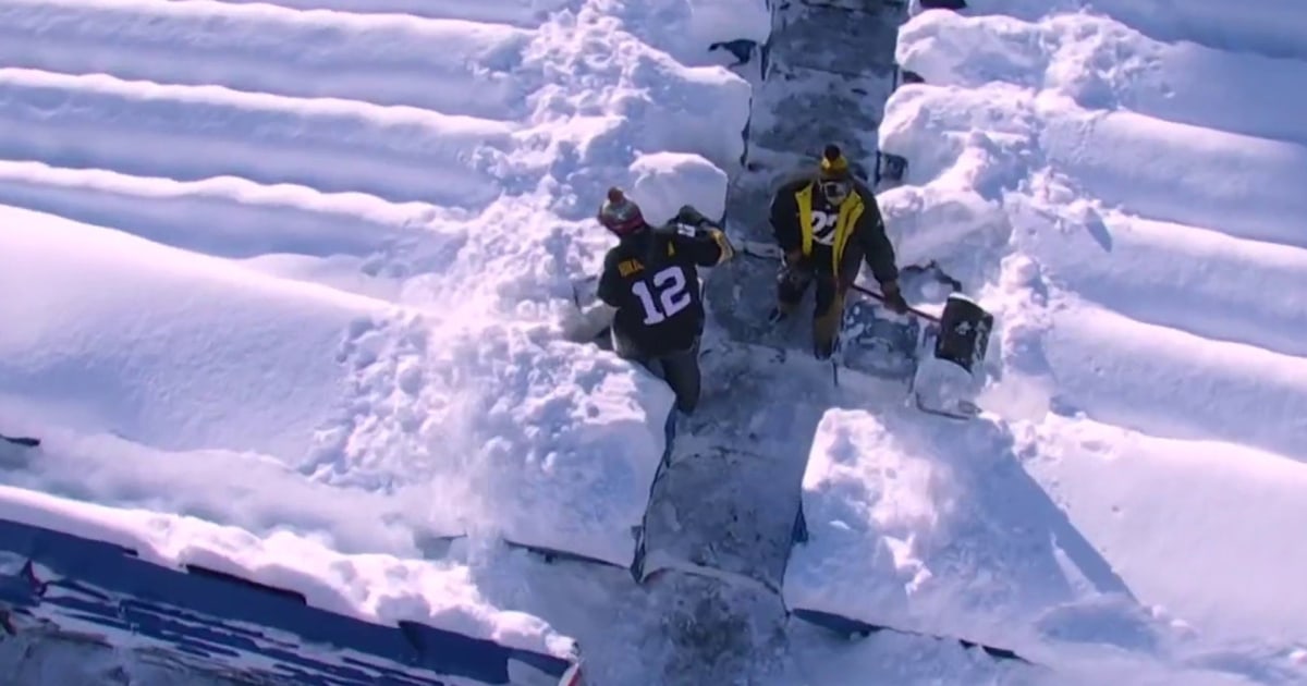 Buffalo Bills fans dig through snow to see their team play