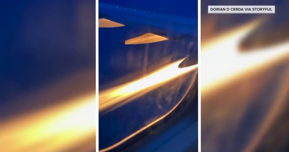 Flames seen shooting out of United Airlines plane during flight