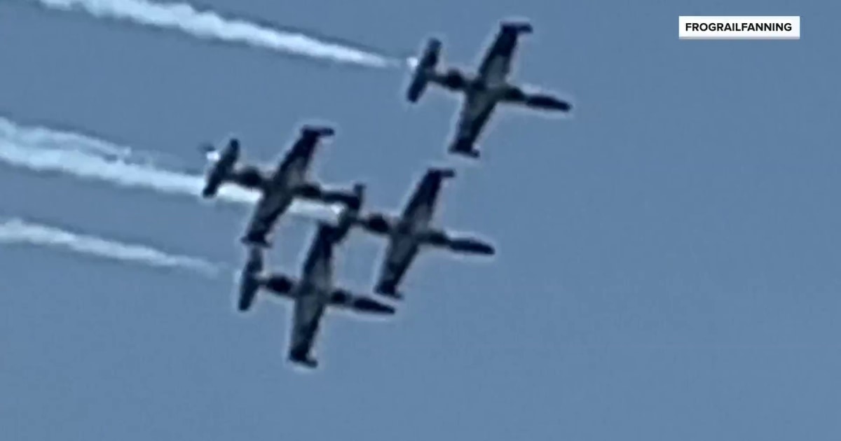 Planes flying in formation touch wings before landing safely