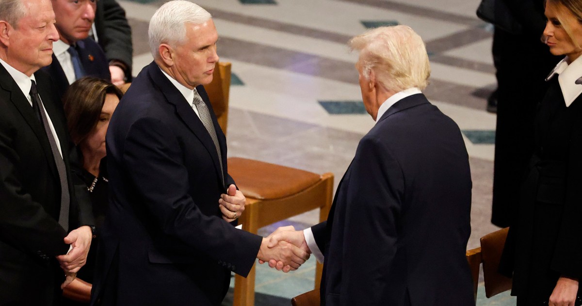 Trump shakes hands with Mike Pence at Jimmy Carter funeral